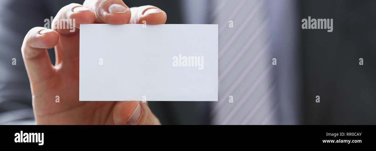 Male arm in suit give blank calling card Stock Photo - Alamy