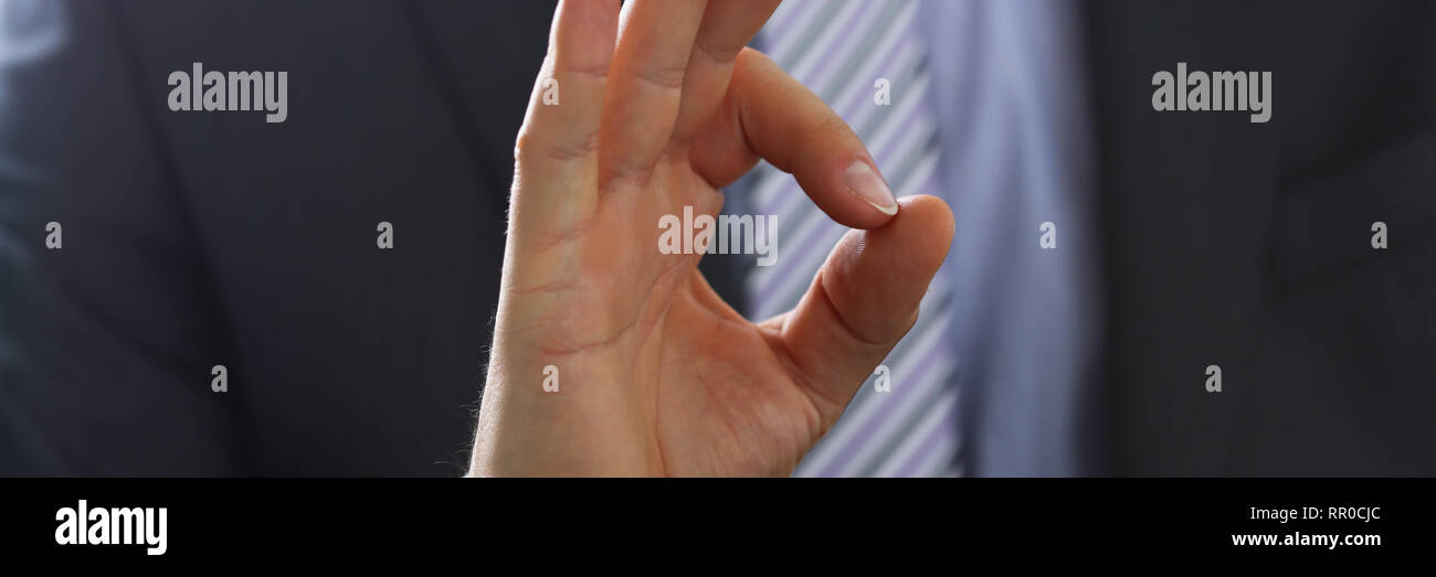 Male hand showing OK or confirm sign with Stock Photo - Alamy