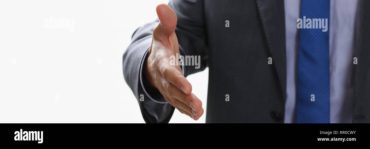Man in suit and tie give hand as hello Stock Photo - Alamy