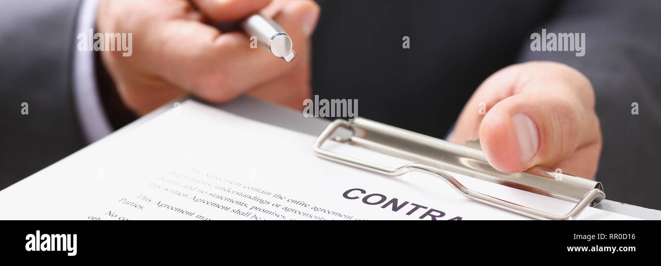 Male arm in suit offer contract form on Stock Photo - Alamy