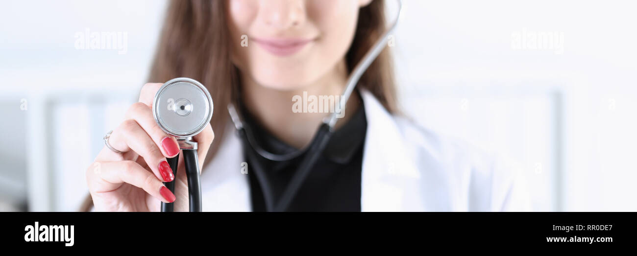 Beautiful smiling female doctor hold in hand Stock Photo - Alamy