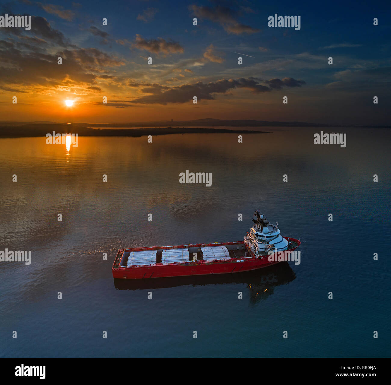 Aerial view of beautiful large ship at sunset. Colorful landscape with ...