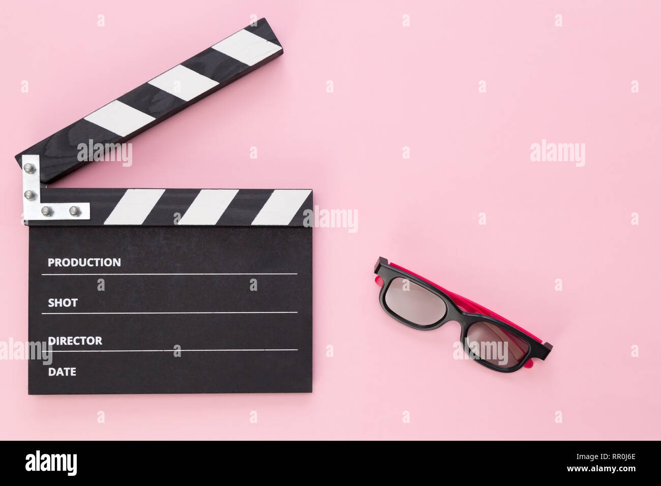 black clapperboard isolated on color background, flat lay Stock Photo ...