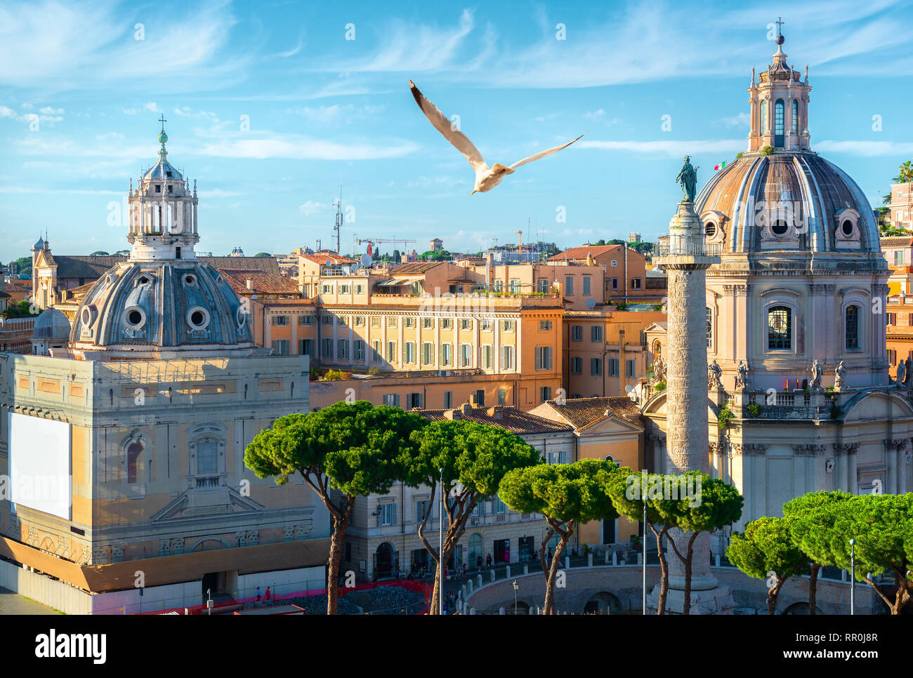 Trajan's column and churches in Rome at sunset Stock Photo - Alamy
