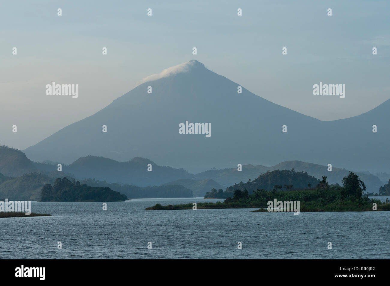 Lake Mutanda with views of volcanoes of the Virunga Mountains, Uganda ...