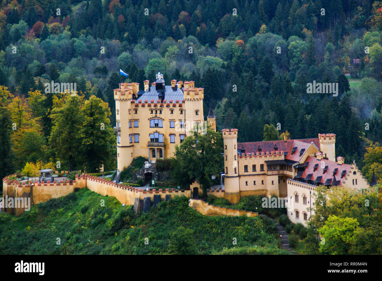 a castle surrounded by an autumn forest Stock Photo - Alamy