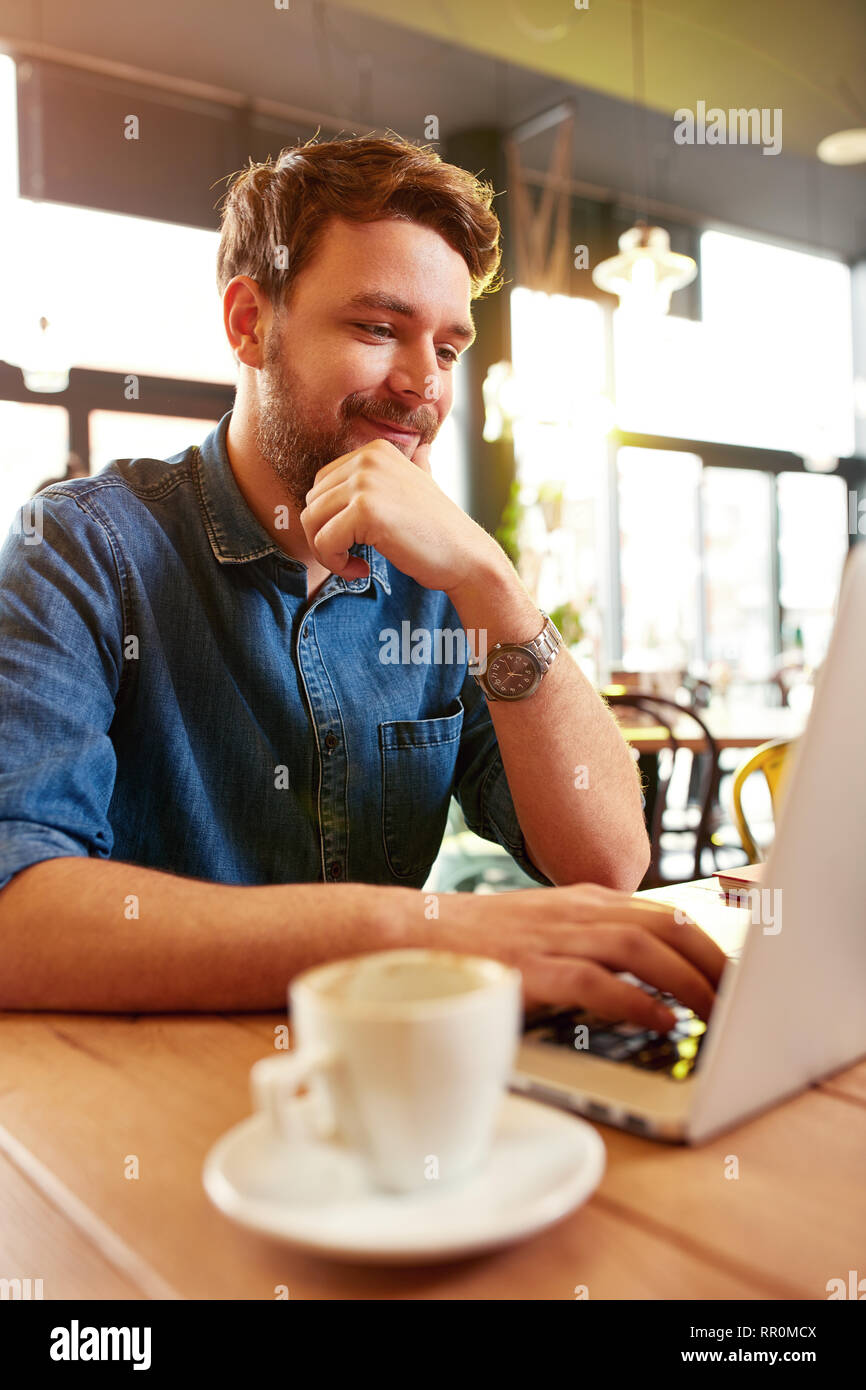 Teenage male laptop cafe hi-res stock photography and images - Alamy