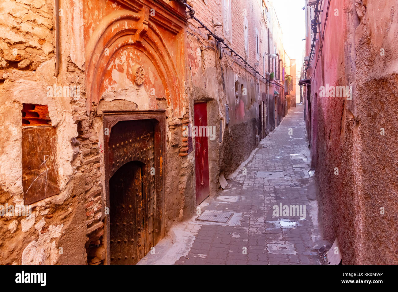 Colorful ancient old and narrow street in medina of Marrakech, Morocco ...