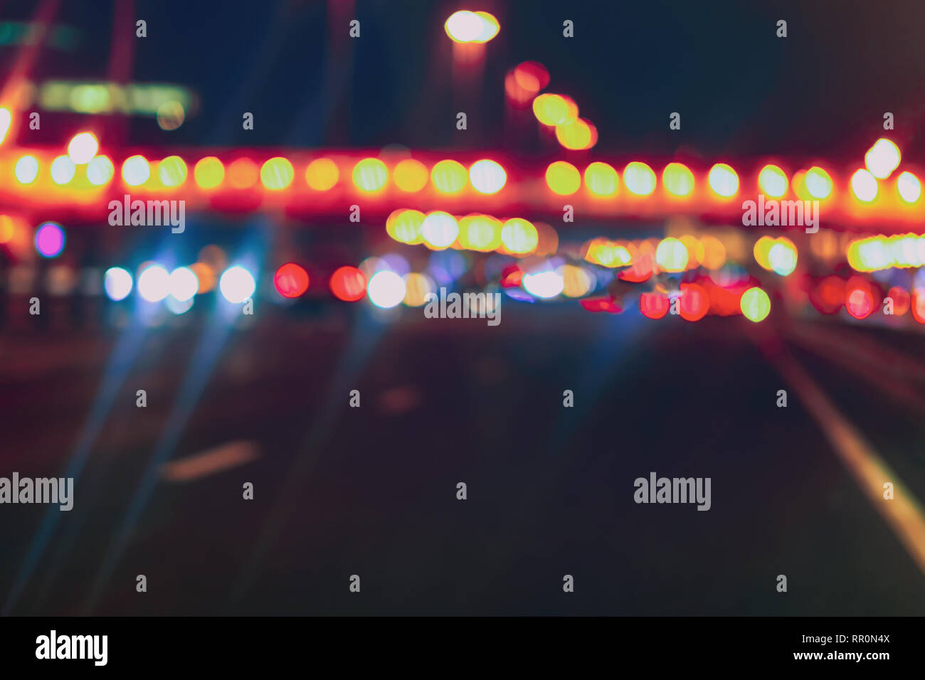 Blurred bokeh lights of the city at night, lighted bridge at night ...