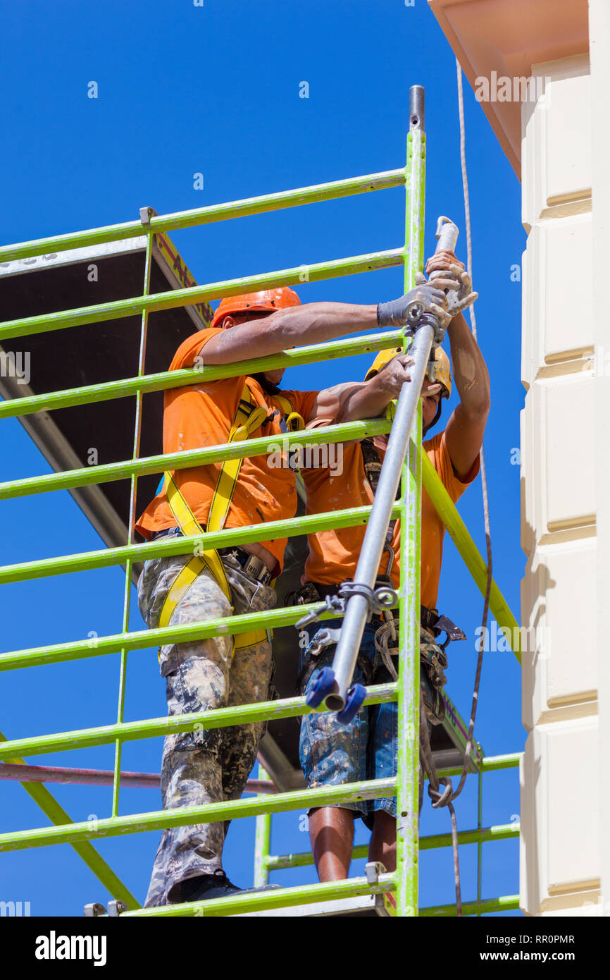 construction workers on a scaffold Stock Photo - Alamy