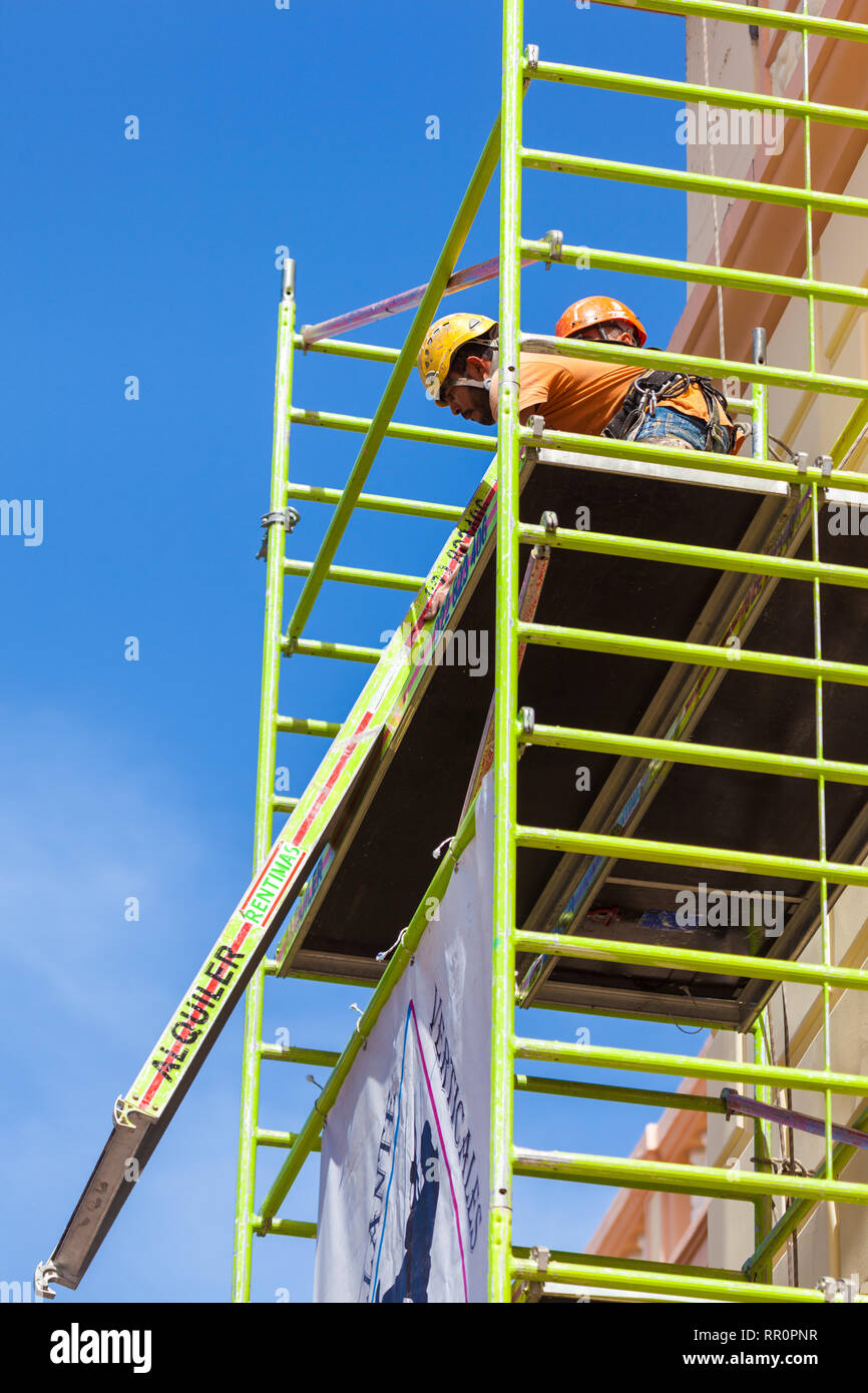 construction workers on a scaffold Stock Photo - Alamy