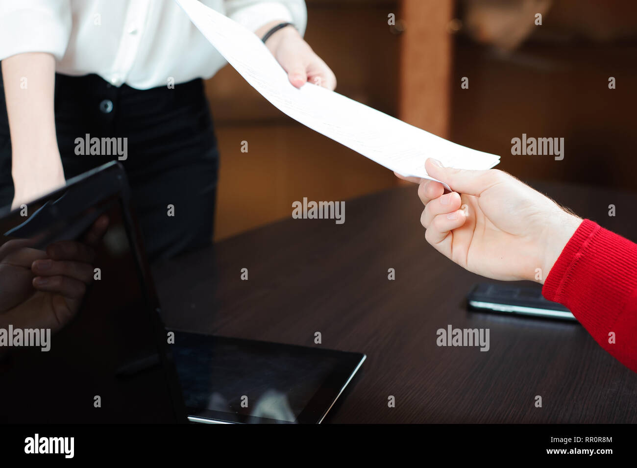 Business office team passing documents hi-res stock photography and ...