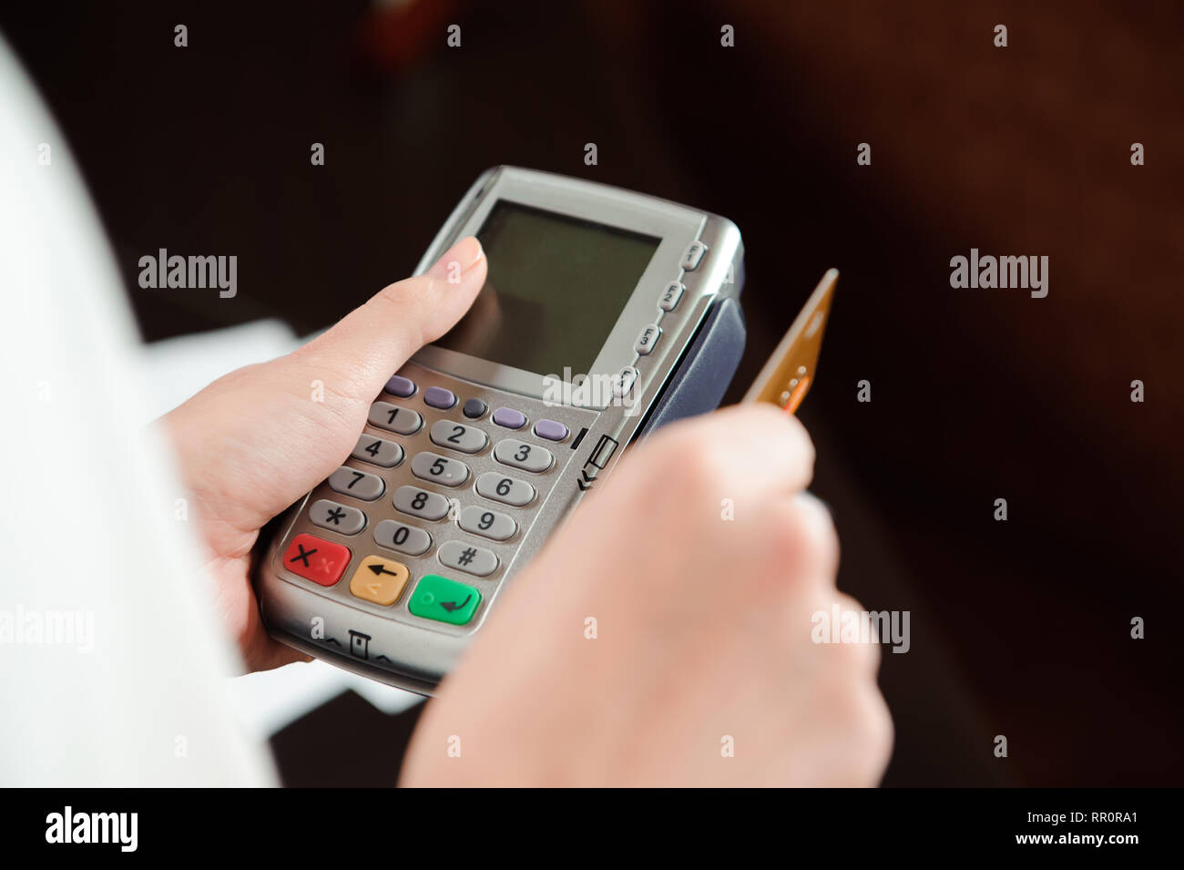 Hand swiping debit card on pos terminal Stock Photo - Alamy Hand swiping debit card on pos terminal Stock Photo - Alamy