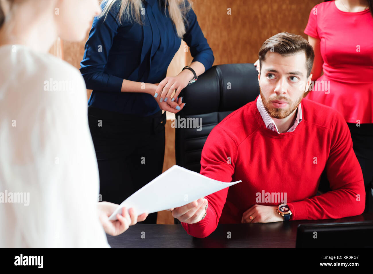 Business office team passing documents hi-res stock photography and ...