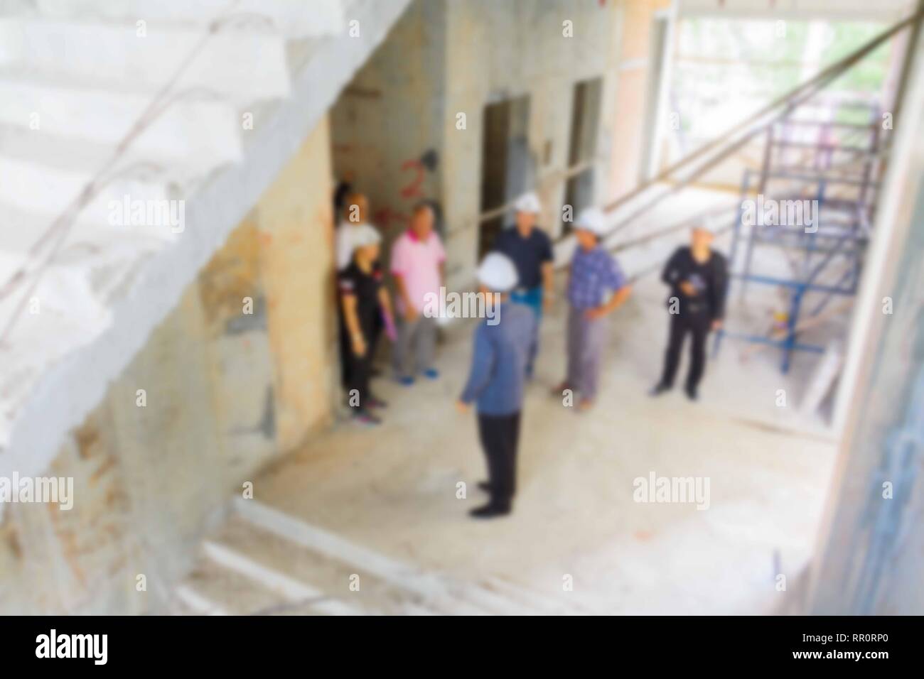 blur of group businessman engineering check in construction building ...
