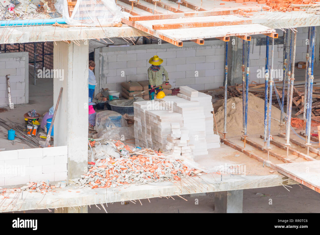 construction workers site and building of housing at laborer work ...