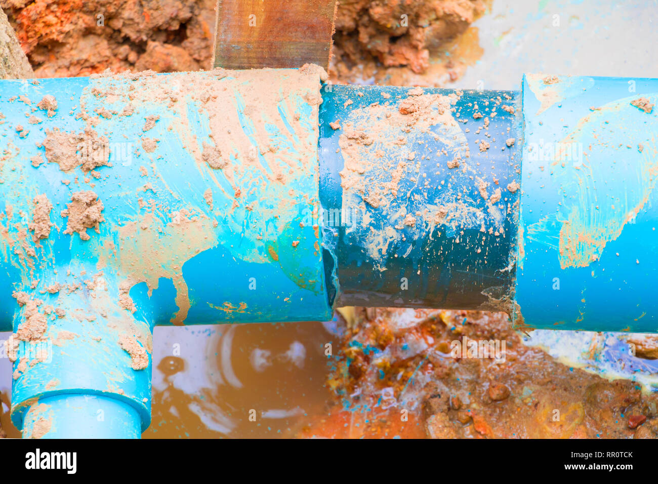 repair plumbing PVC broken pipe which has water with copy space add tex ...