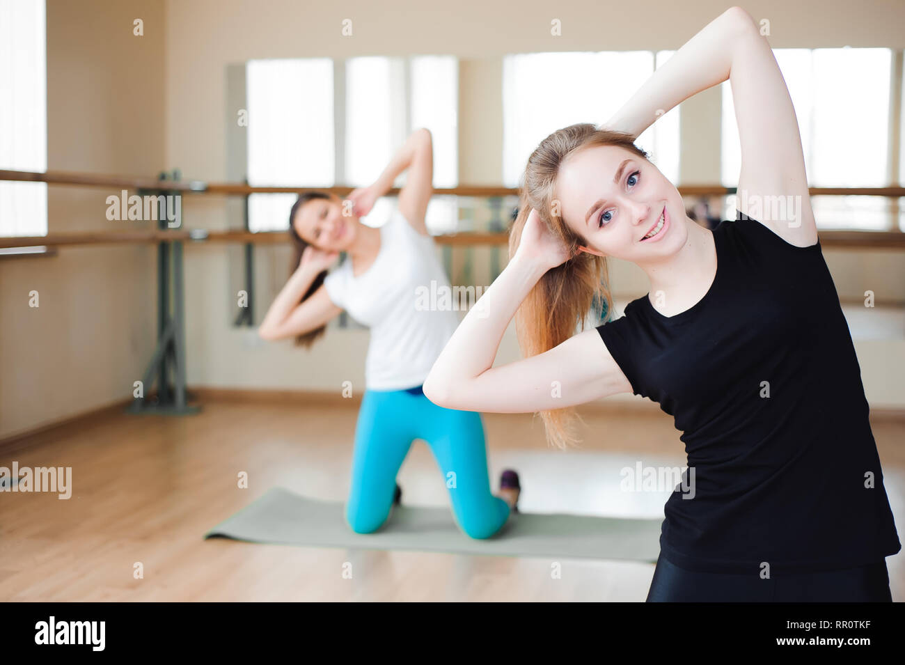 Fit smiling group doing exercise in the gym Stock Photo - Alamy