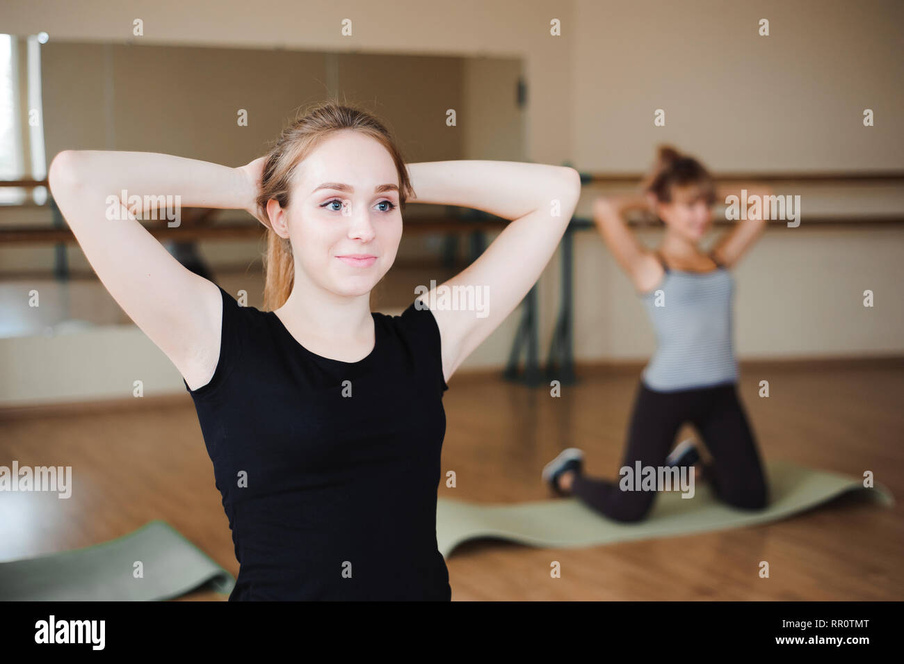 Fit smiling group doing exercise in the gym Stock Photo - Alamy