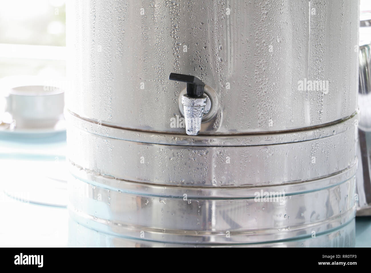 faucet cold drinking water stainless tank with water drops Stock Photo ...