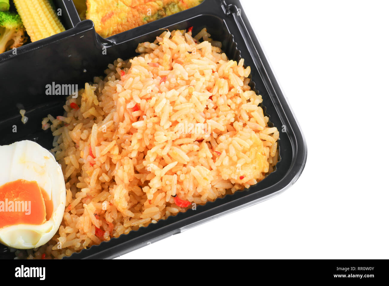 close up fried rice with egg and vegetables in lunch box set on white ...