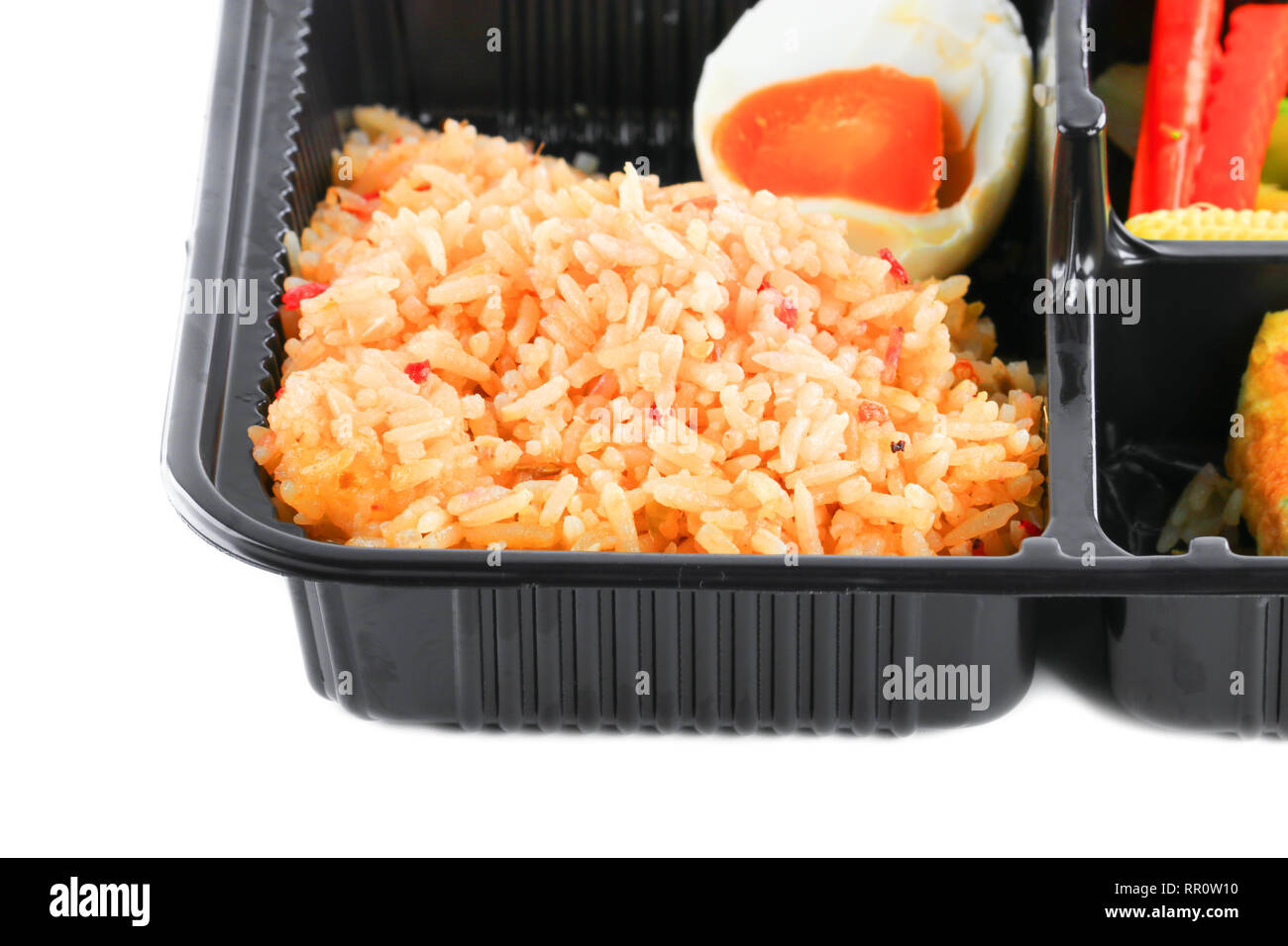 close up fried rice with egg and vegetables in lunch box set on white background Stock Photo - Alamy