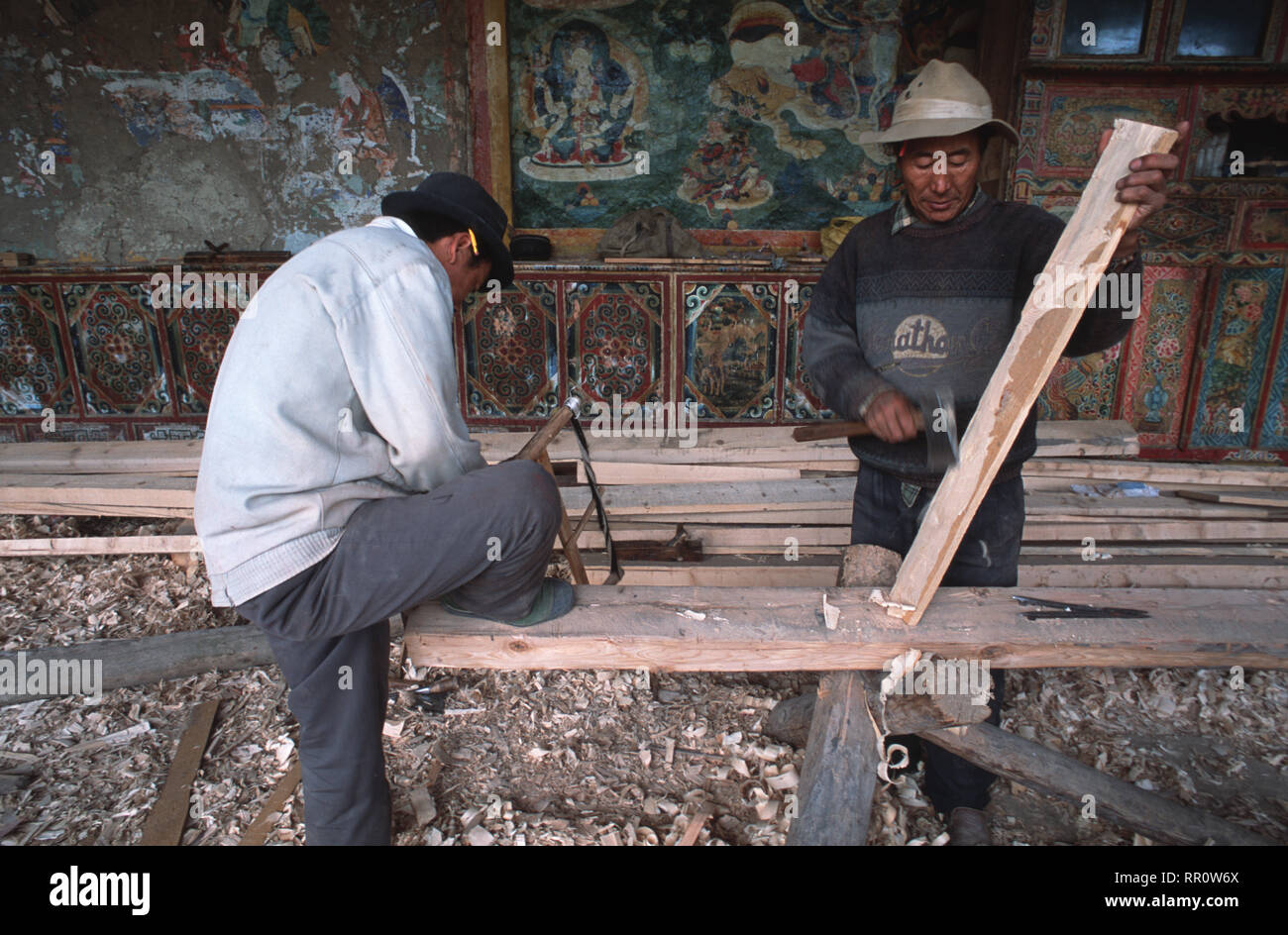 Caption: Ganzi, Sichuan, China - Aug 2002. A carpenter working to ...