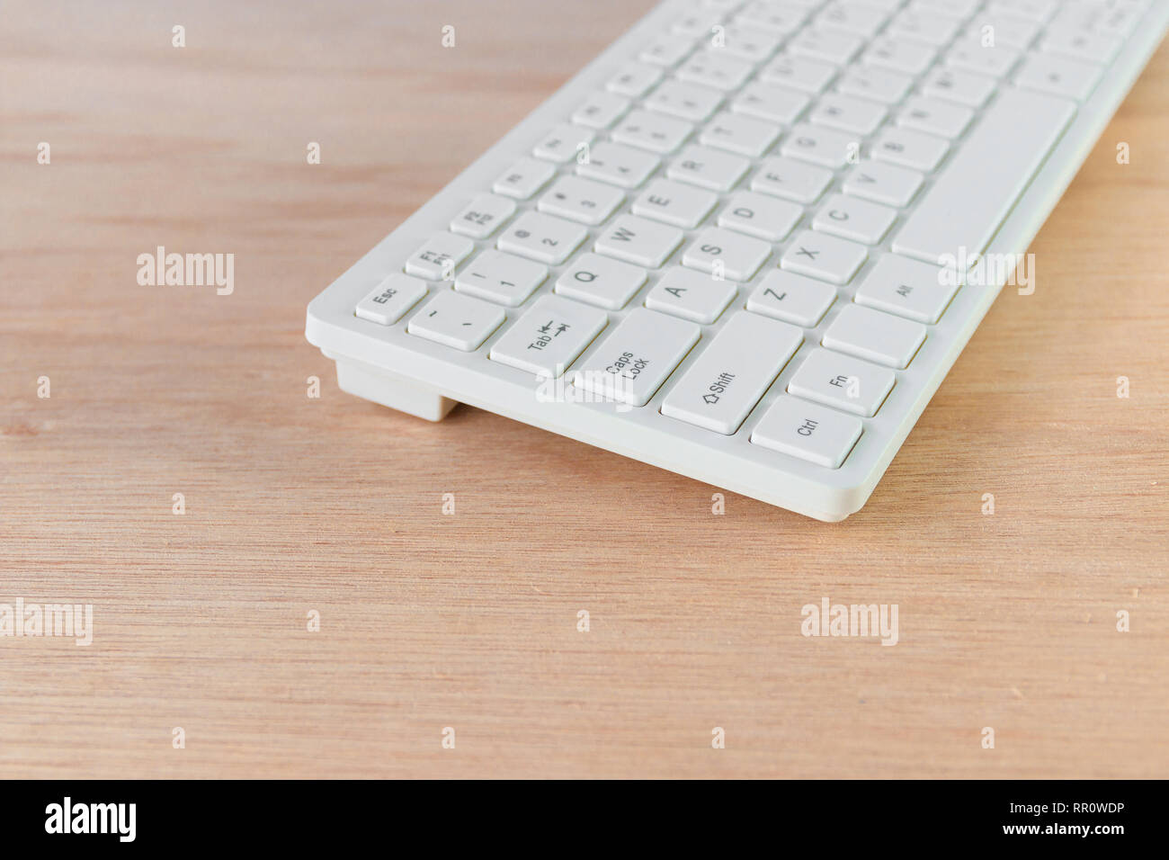 computer keyboard white on wooden floor with copy space add text ( high ...