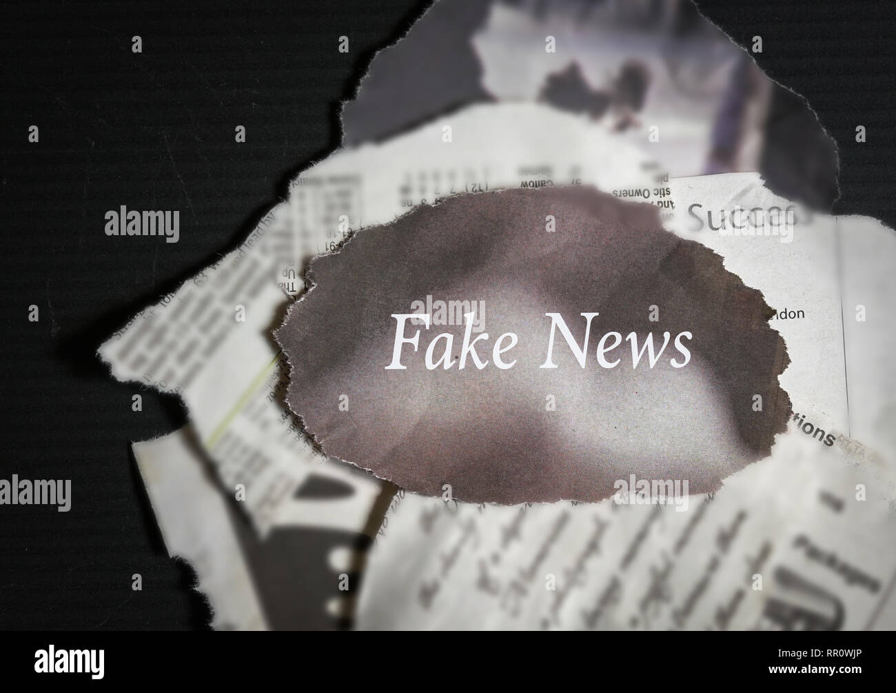 Fake news concept - words on top of a stack of newspapers Stock Photo ...
