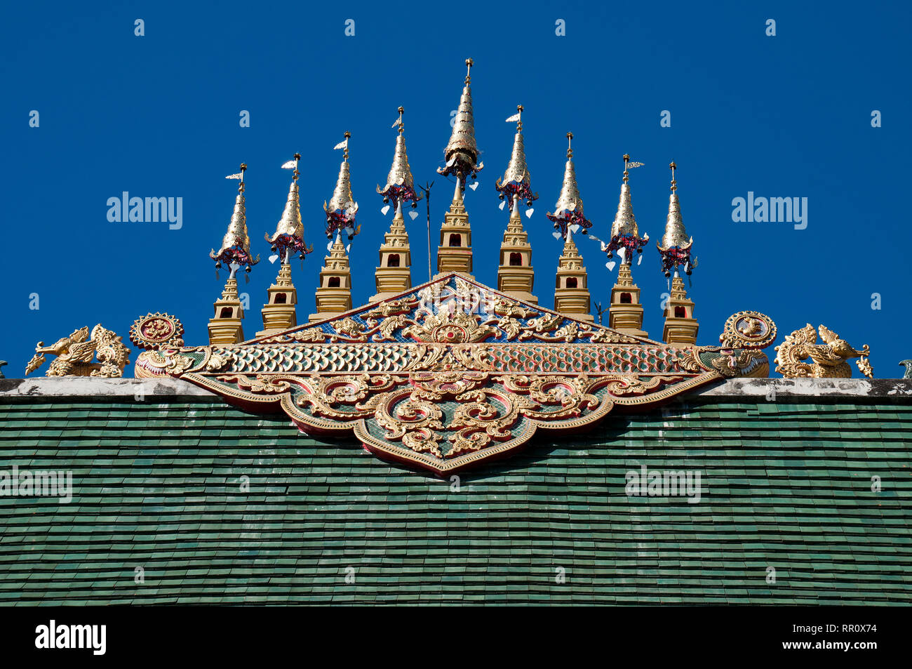 Chiang Rai Thailand, detailed roof decoration centered on the green ...