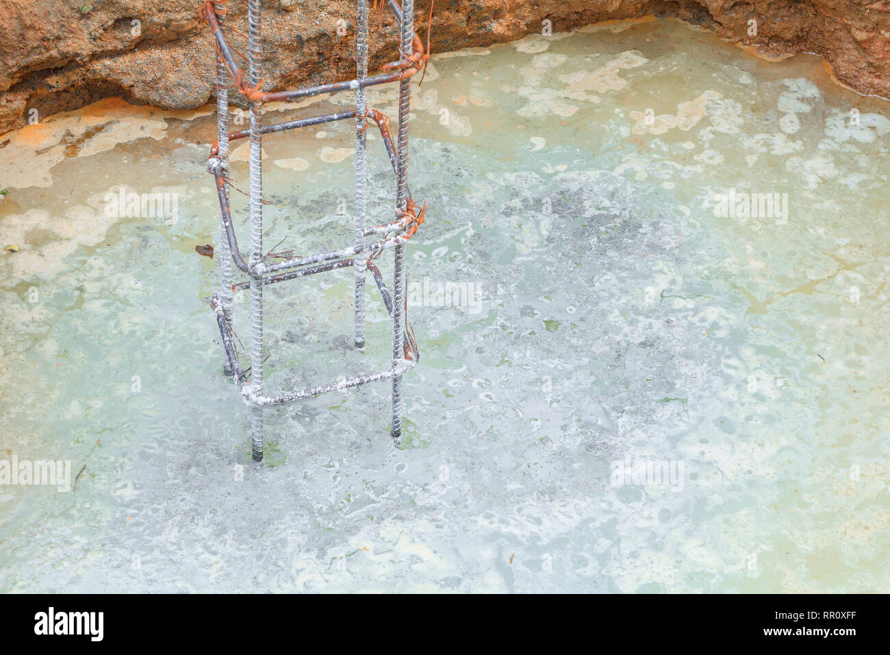 post metal in Hole of foundation construction building site making with ...