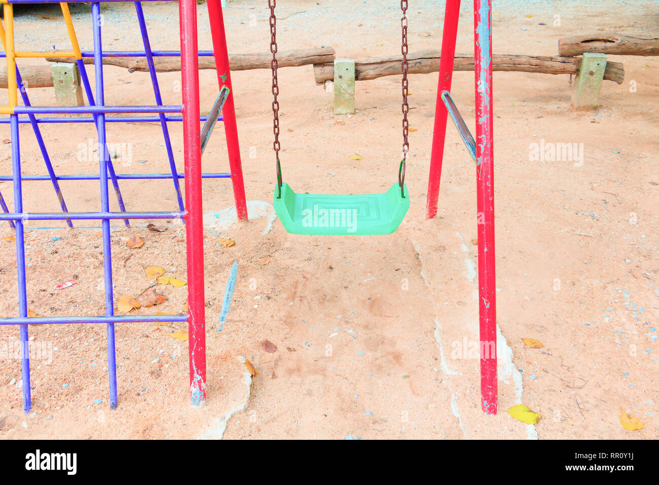 old swing in school children playground countryside Stock Photo - Alamy