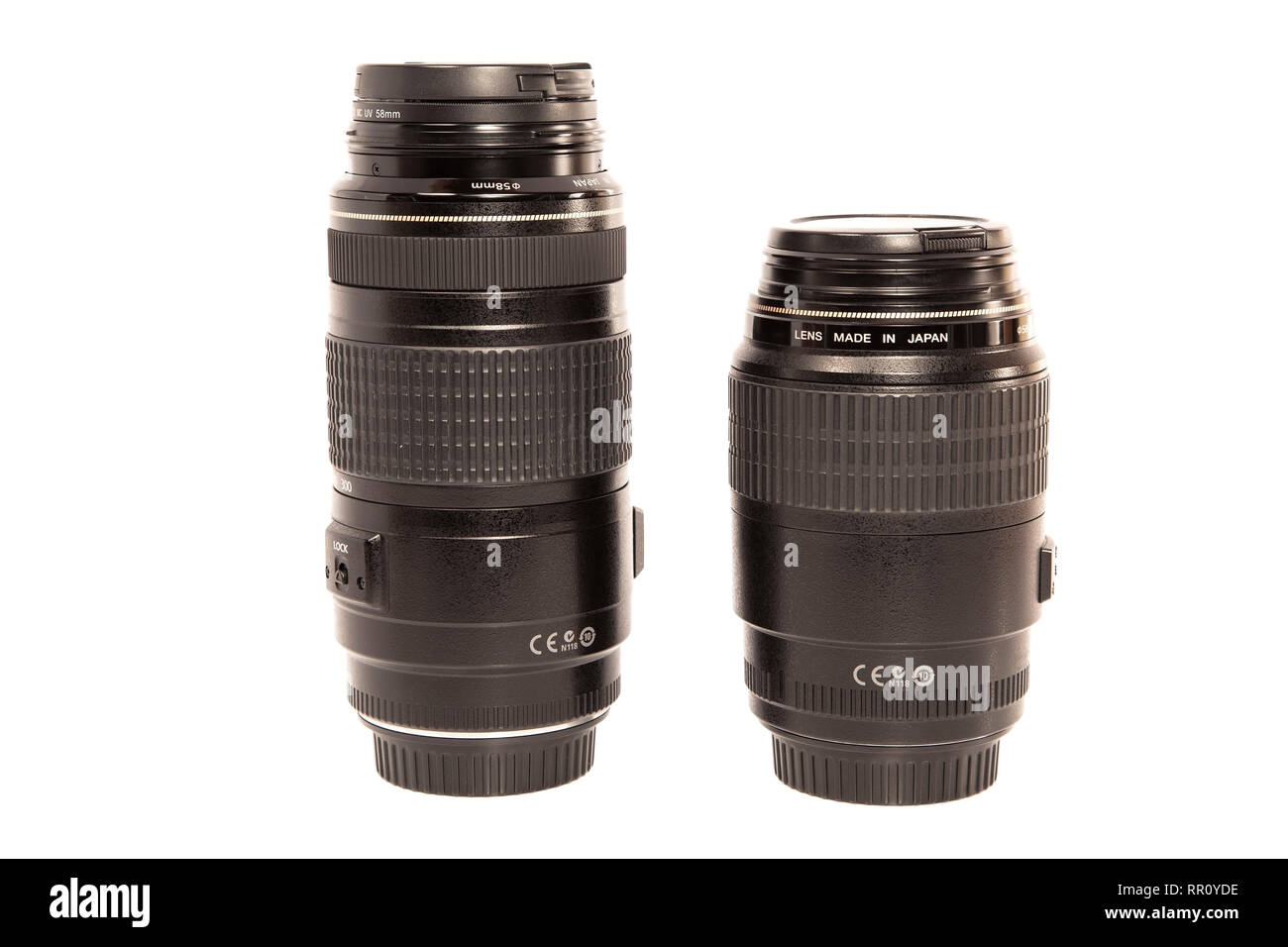 Two camera lenses isolated on white background Stock Photo - Alamy