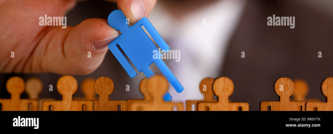 Man arm in suit take little plastic toy figure Stock Photo - Alamy