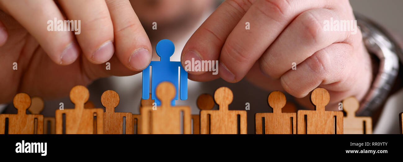 Man arm in suit take little plastic toy figure Stock Photo - Alamy