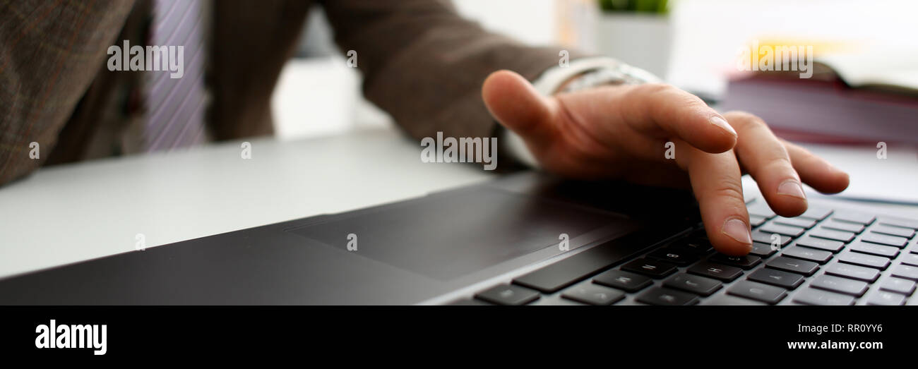 Male arms in suit typing on silver keyboard Stock Photo - Alamy