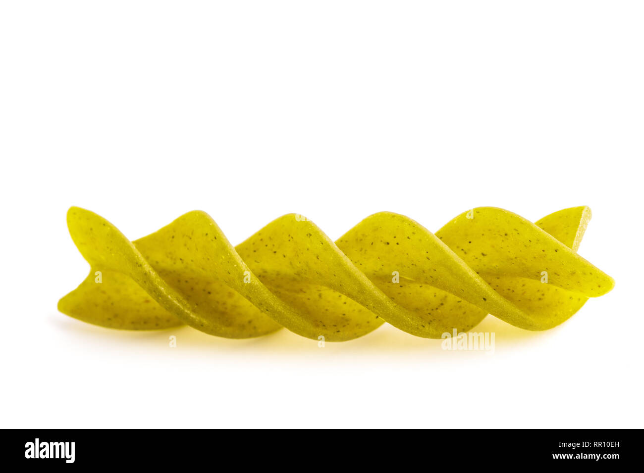 Green fusilli isolated on white background Stock Photo - Alamy