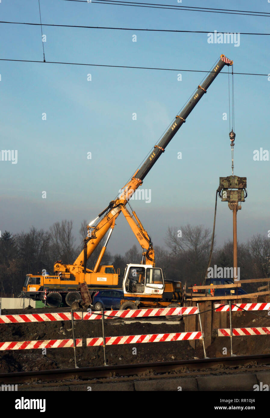 Crane behind the fence hi-res stock photography and images - Alamy