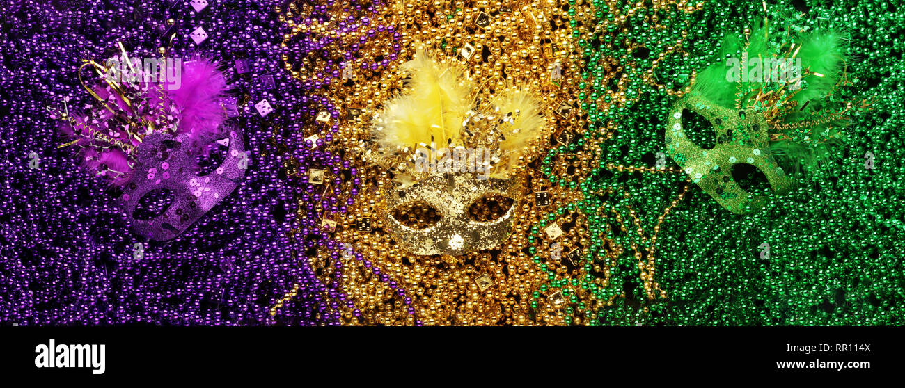 Purple, Gold, and Green Mardi Gras beads and masks background Stock ...