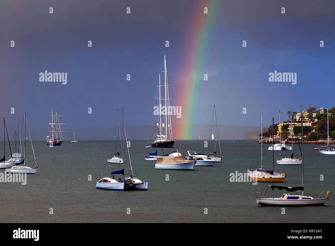 Rainbow over Fidelis on Sydney Harbour Stock Photo - Alamy