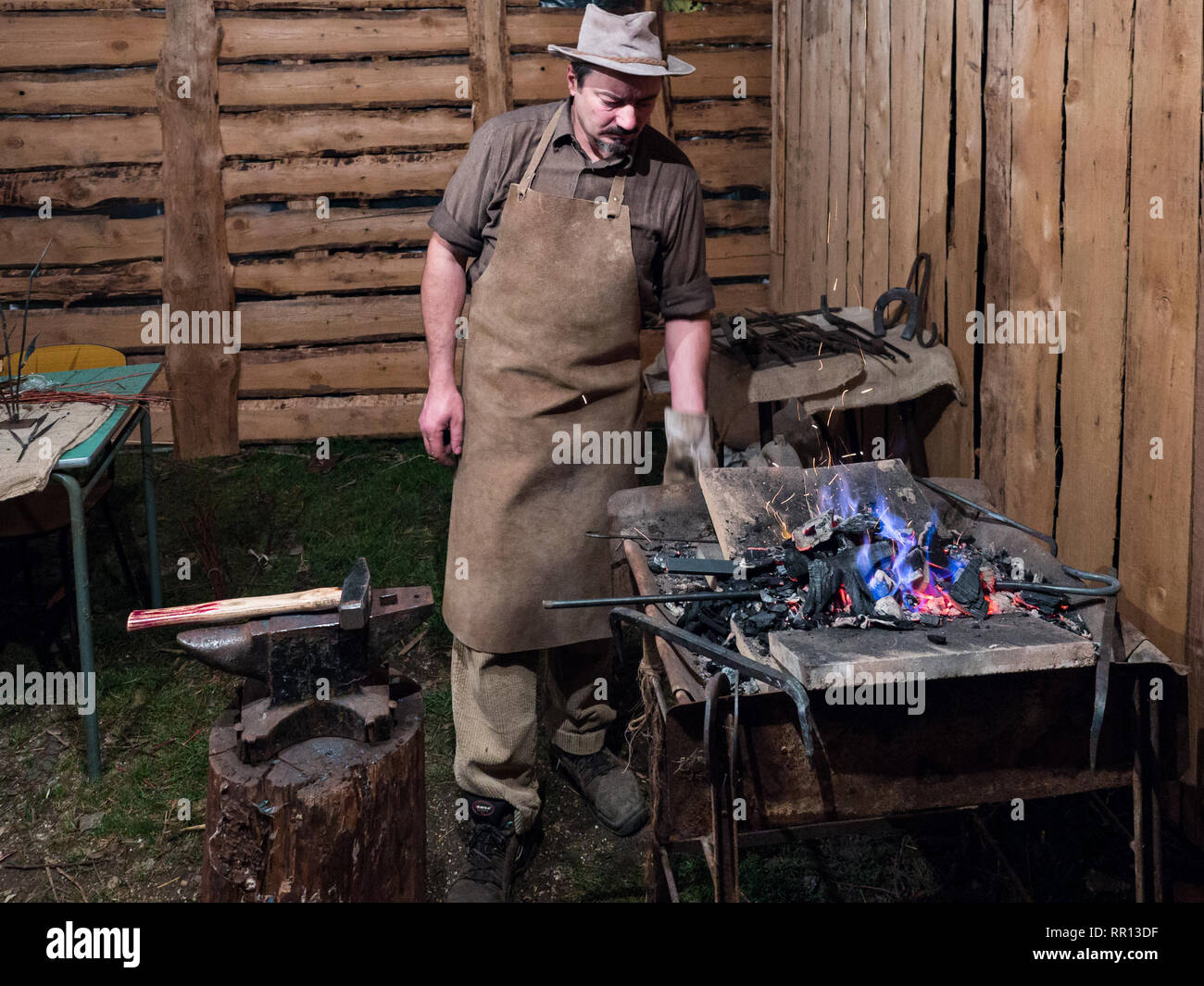 Verona, Italy - December 26, 2018: Blacksmith heats the iron on the ...