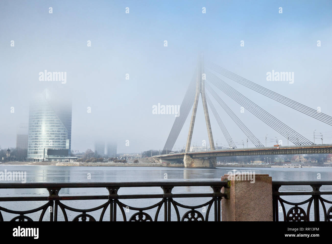 Cable bridge in misty morning, Riga, Latvia Stock Photo - Alamy