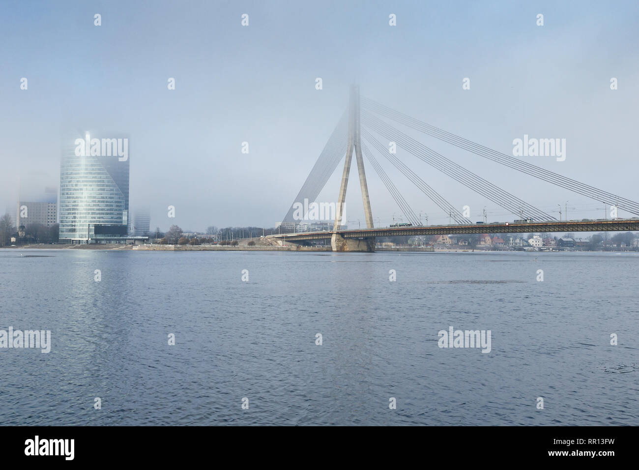 Cable bridge in misty morning, Riga, Latvia Stock Photo - Alamy