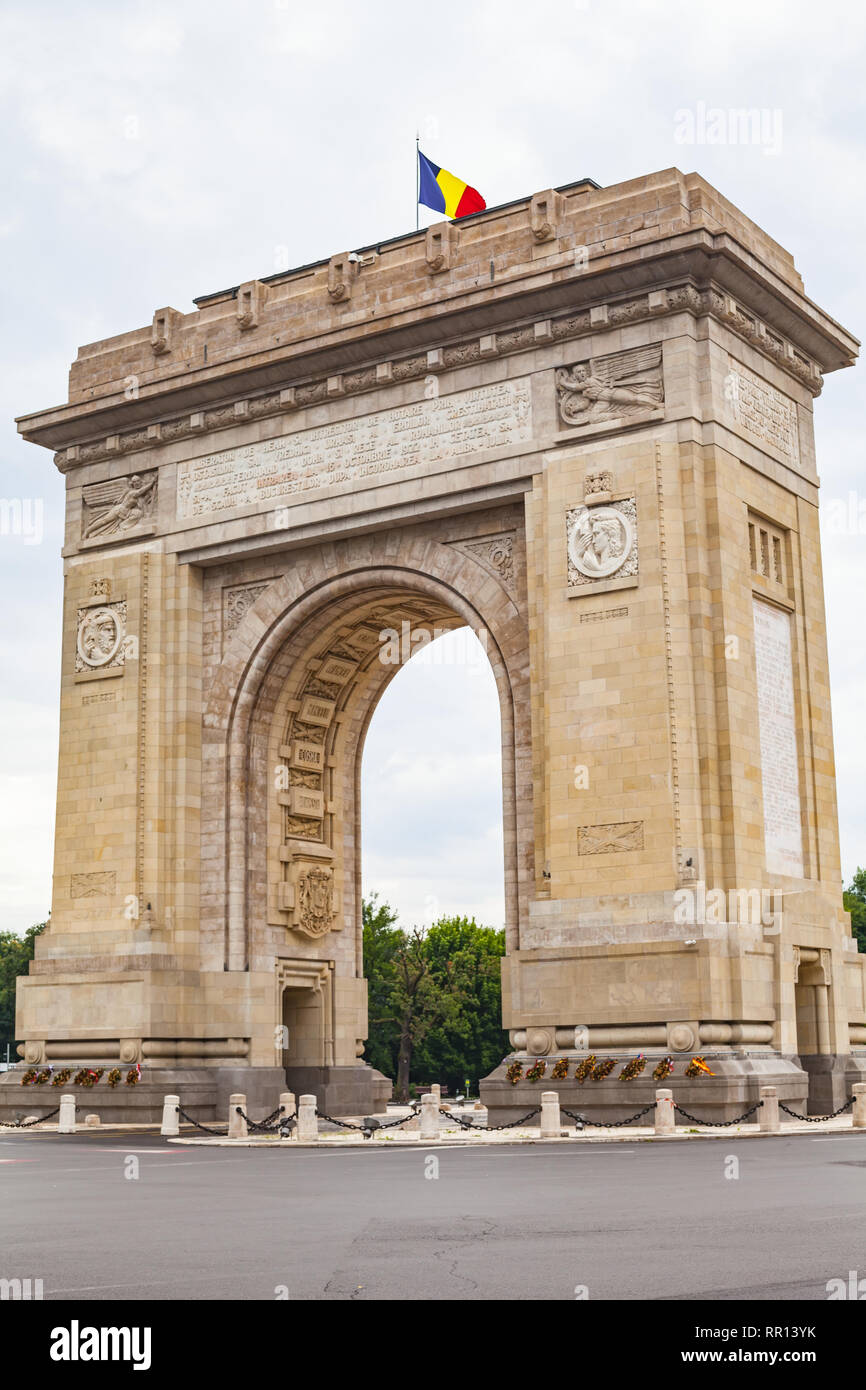 Beautiful picture of the arch of triumph with a romanian flag on it in ...