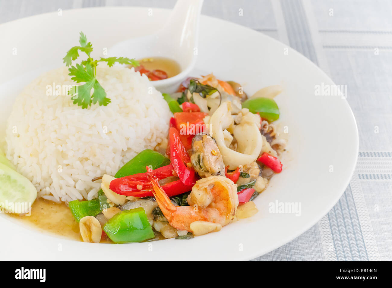 Mixed Seafood fried with chili and vegetables Served with steamed rice ...