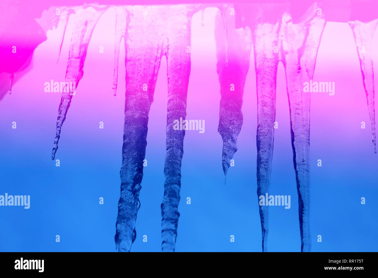 Beautiful big icicles hanging on the building take a close-up picture ...