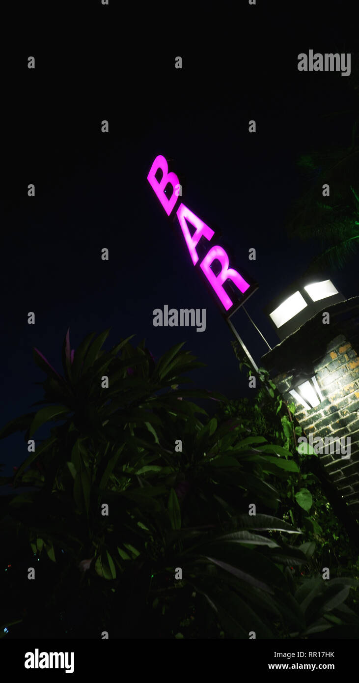 Flouresant neon pink Bar sign - vertical black background Stock Photo ...
