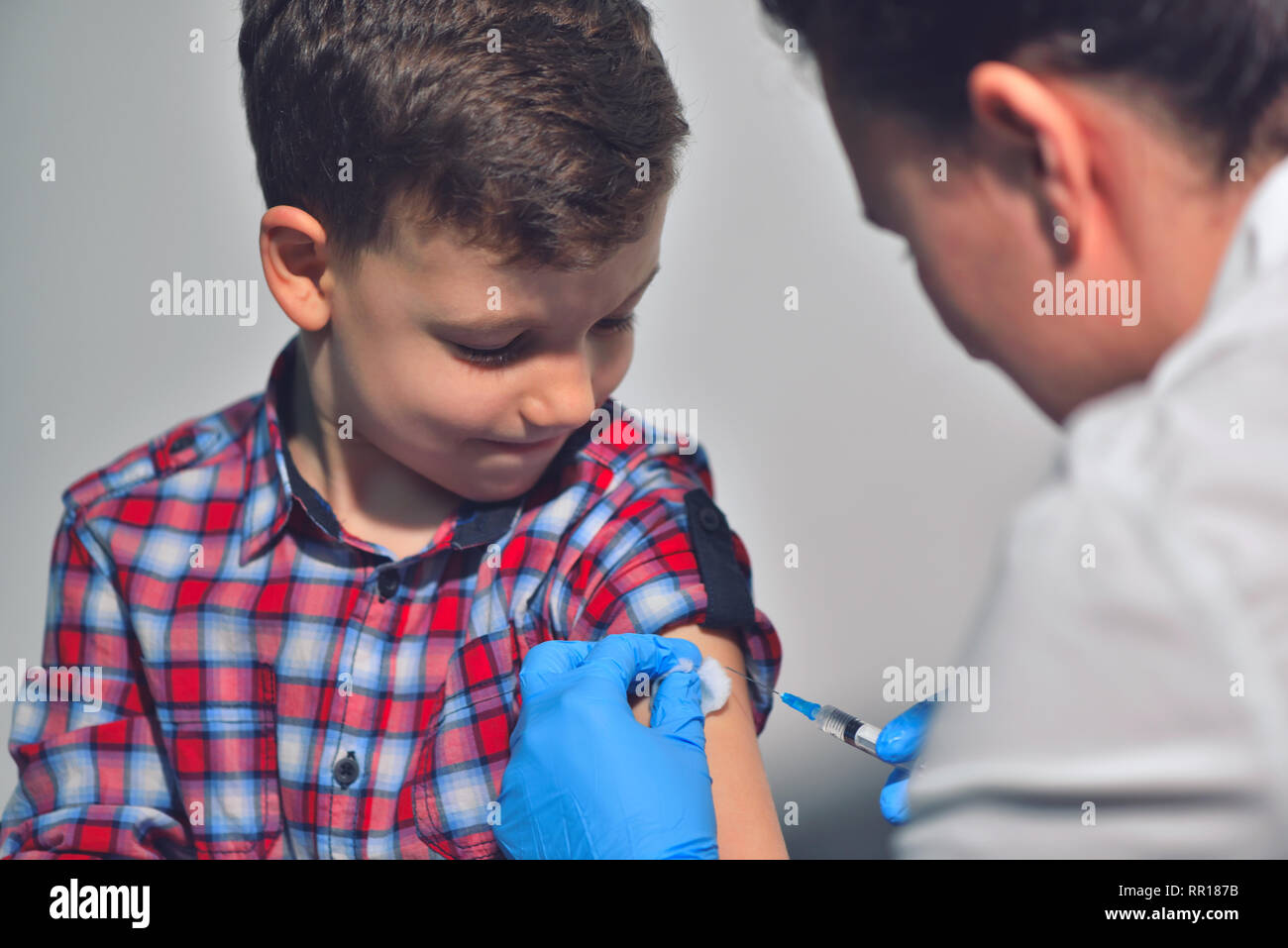 Close-up hands doctor or nurses are vaccination to patient using the ...