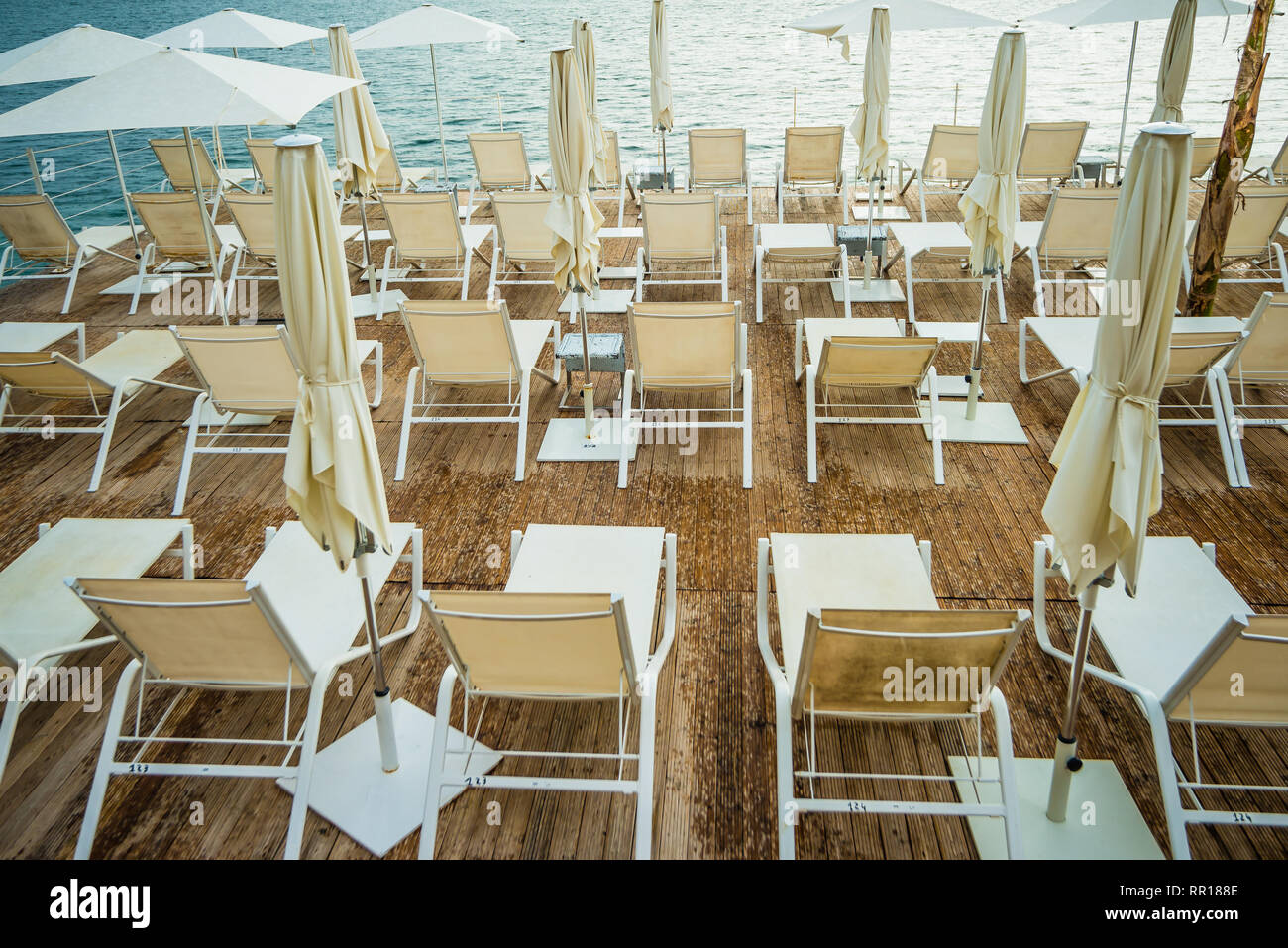 Overview of a beautiful solarium facing the sea on a hot summer day ...