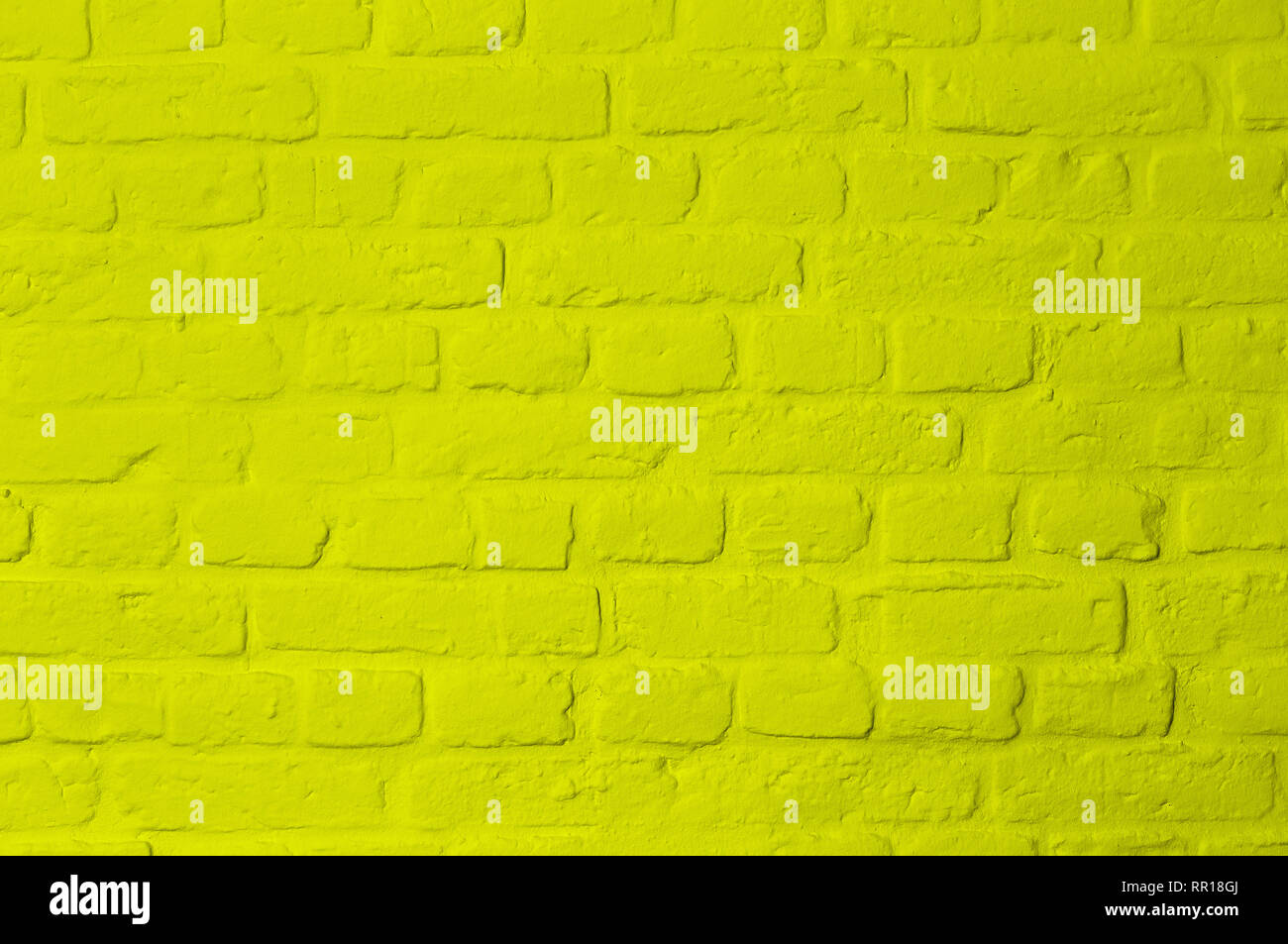 Pastel bright lemon yellow colored brick stone wall, full frame, image ...